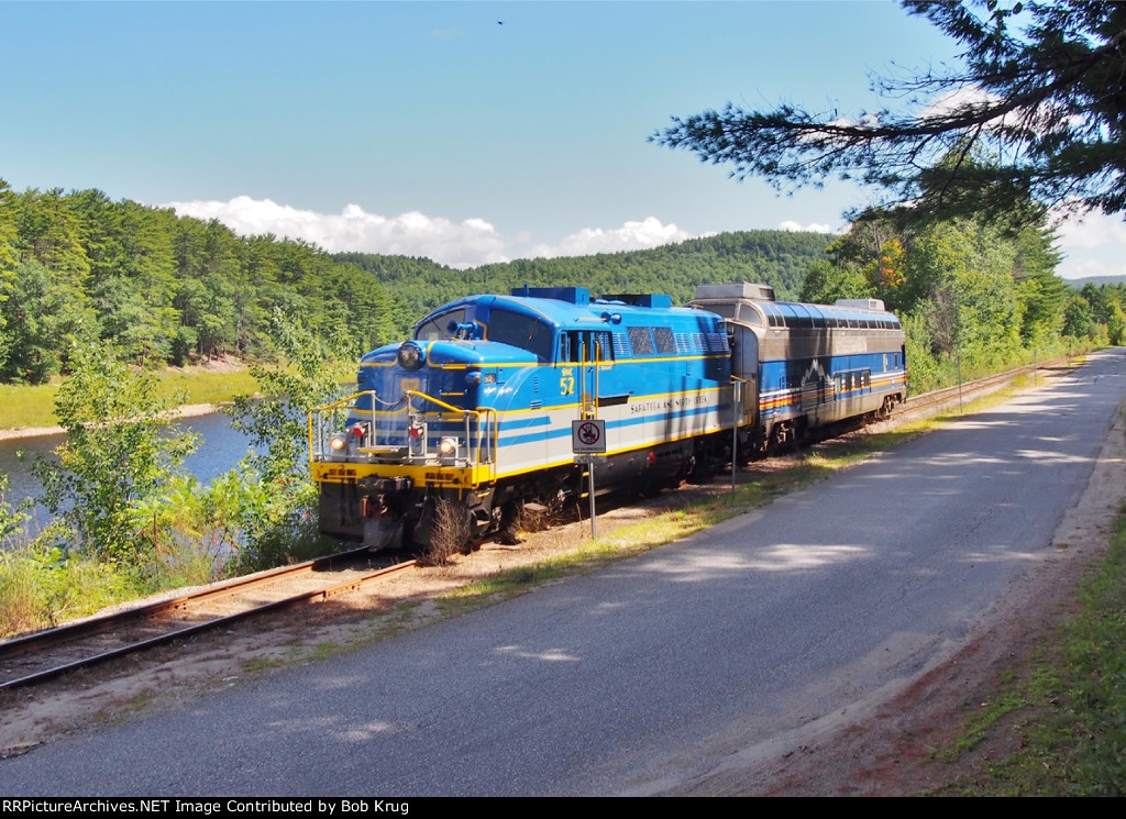 SNC 52 leads the northbound local along River Road